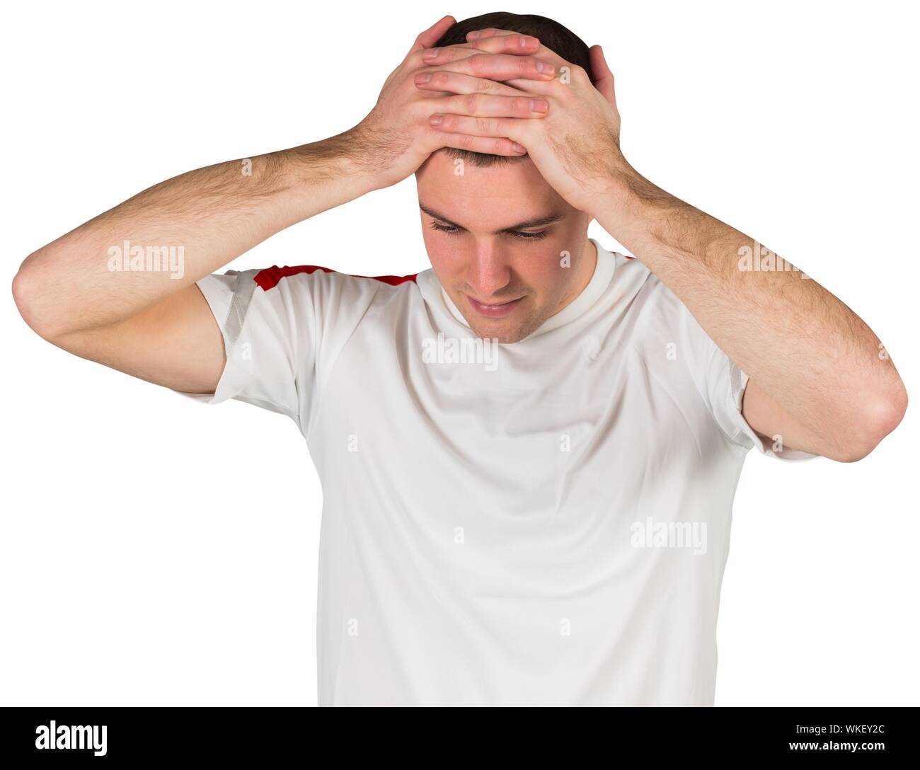 Disappointed football player looking down on white background Stock ...