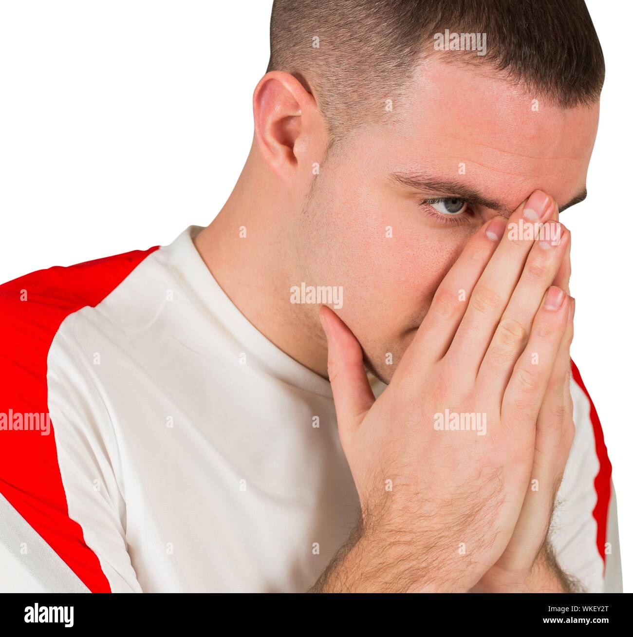 Disappointed football player looking down on white background Stock ...