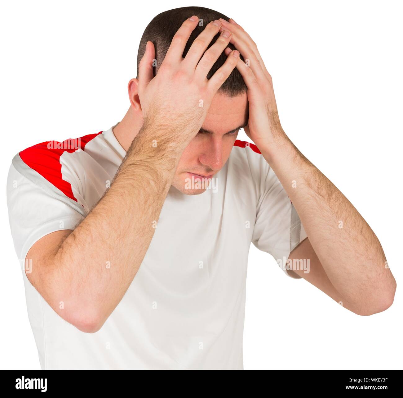 Disappointed football player looking down on white background Stock ...