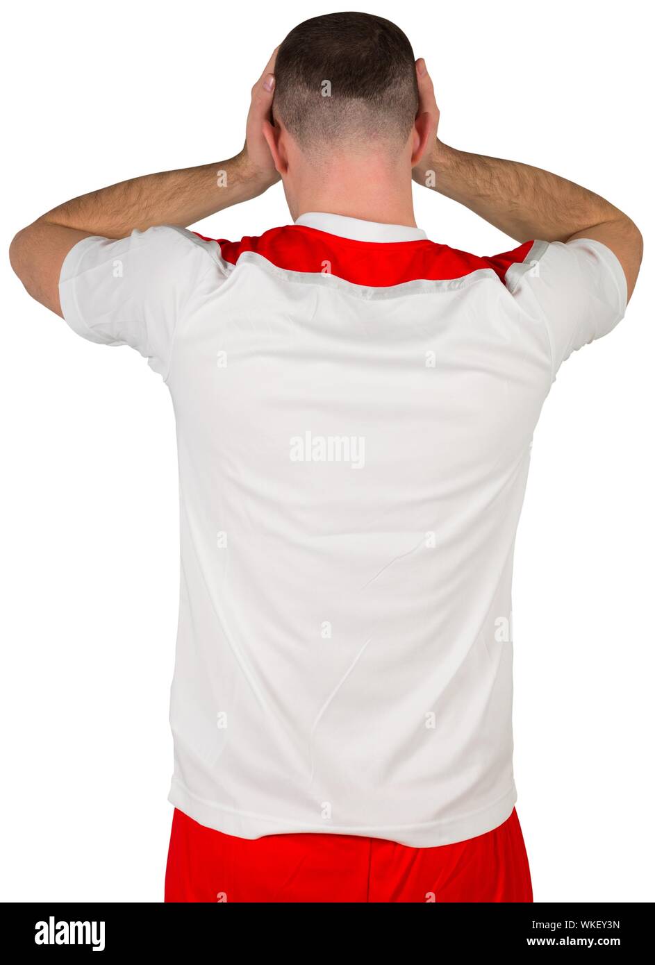 Disappointed football player looking down on white background Stock ...
