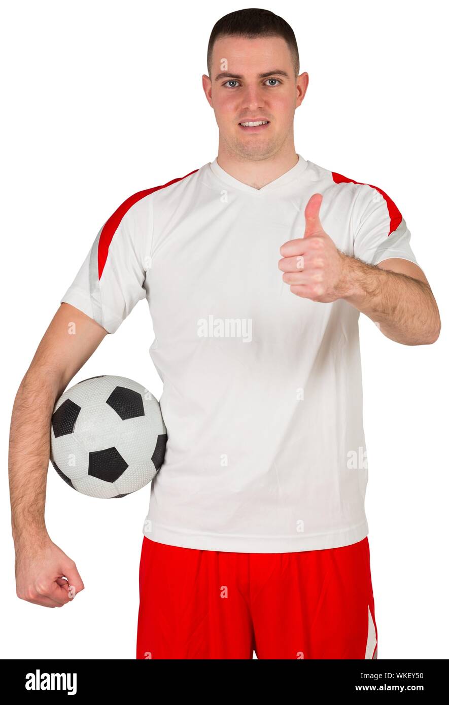 Football player showing thumbs up on white background Stock Photo - Alamy