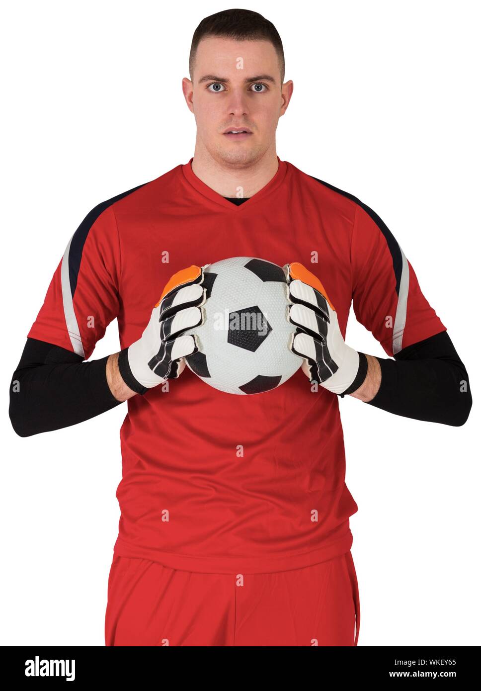Goalkeeper in red looking at camera on white background Stock Photo - Alamy