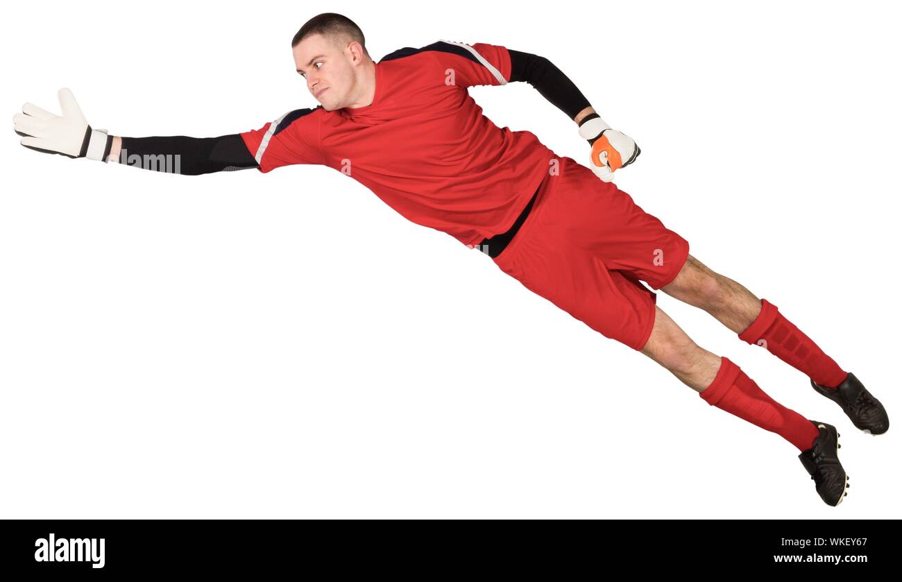 Fit goal keeper jumping up on white background Stock Photo - Alamy