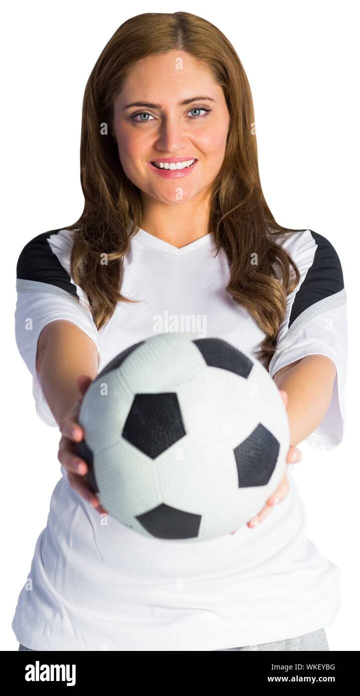 Pretty football fan smiling on white background Stock Photo - Alamy