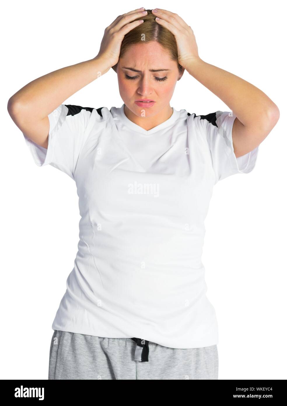 Disappointed football fan looking down on white background Stock Photo ...