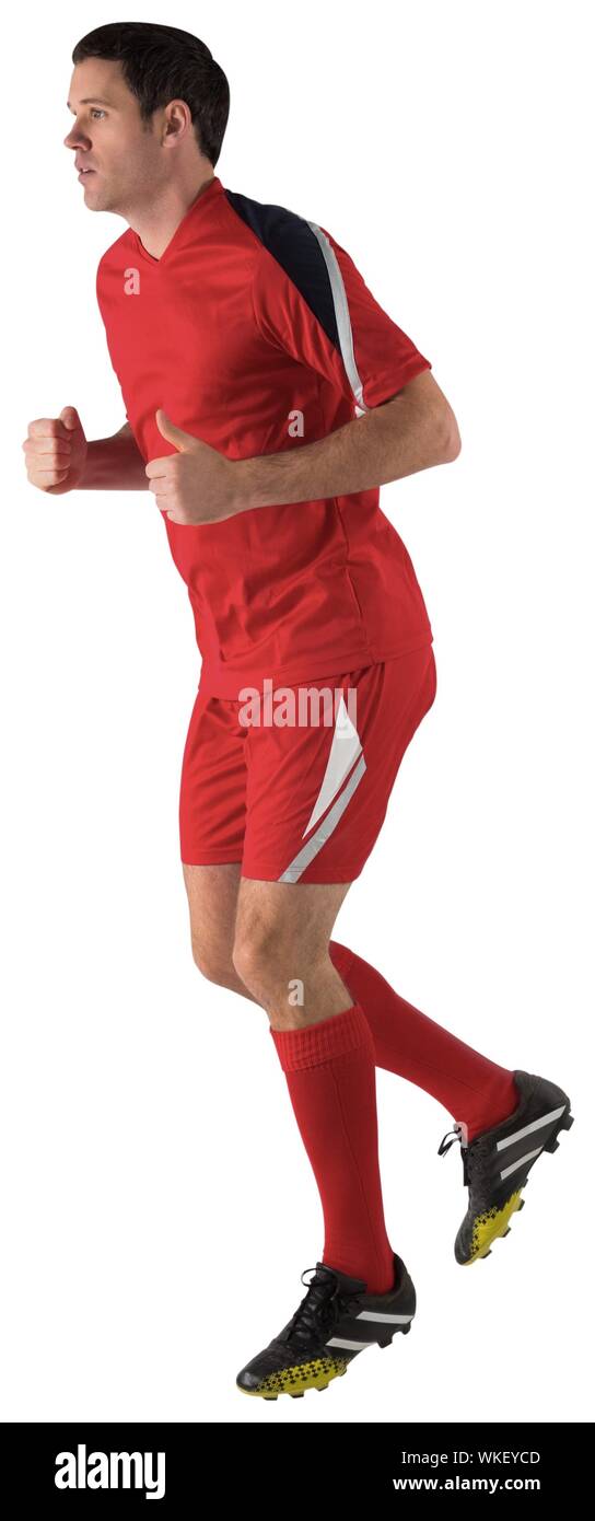 Football player in red running on white background Stock Photo - Alamy