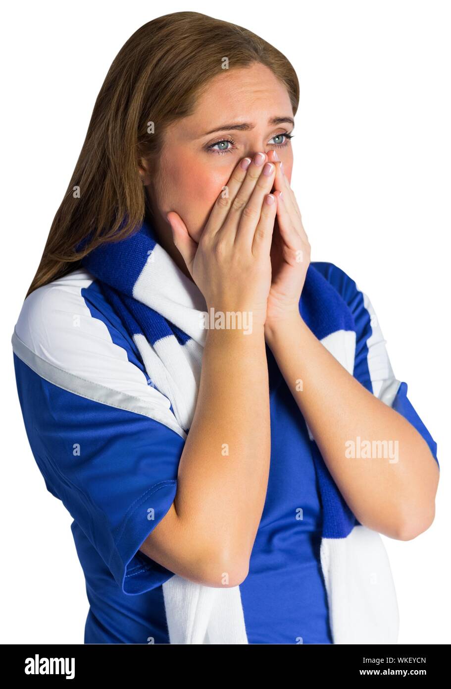 Pretty football fan looking nervous on white background Stock Photo - Alamy