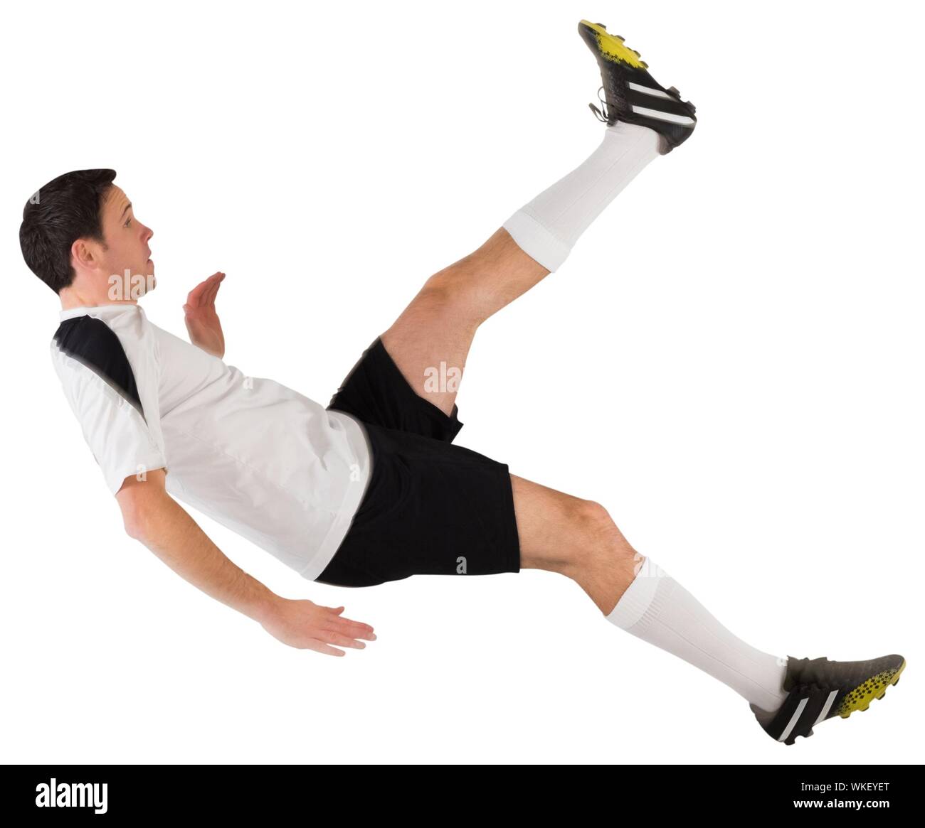 Football player in white kicking on white background Stock Photo - Alamy