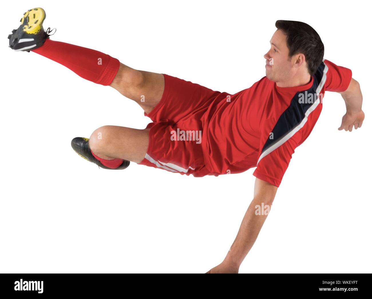 Football player in red kicking on white background Stock Photo - Alamy