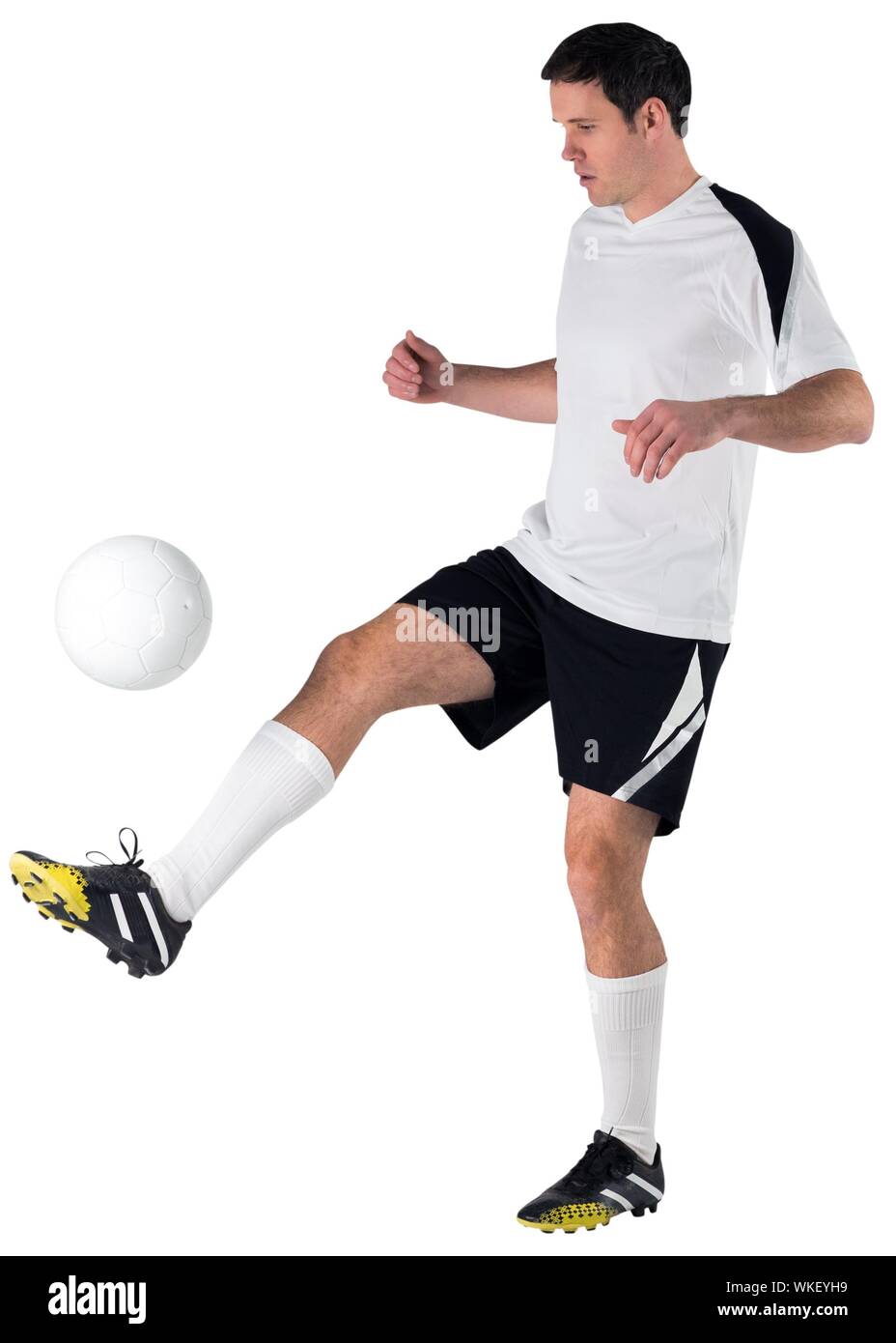 Football player in white kicking on white background Stock Photo - Alamy
