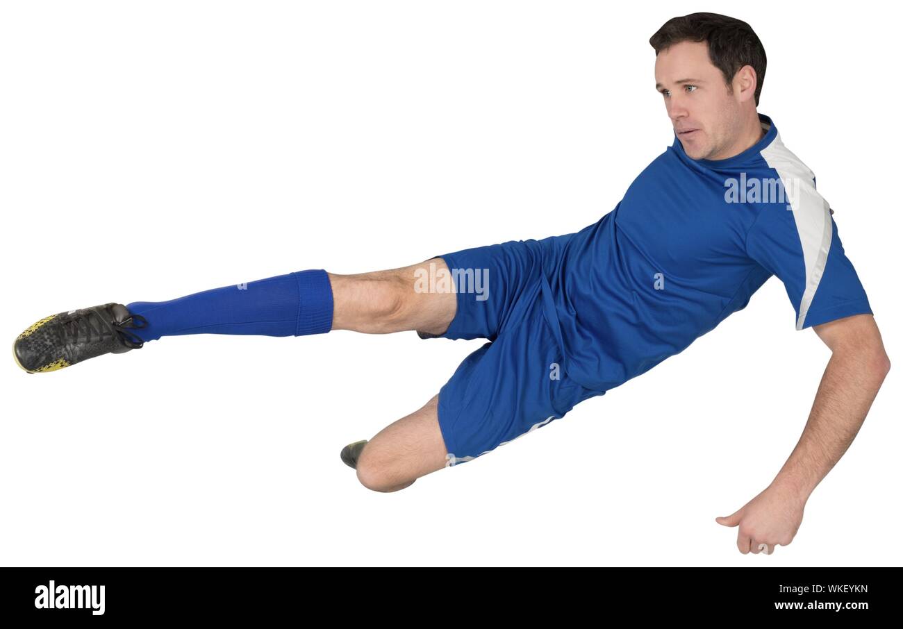 Football player in blue kicking on white background Stock Photo - Alamy