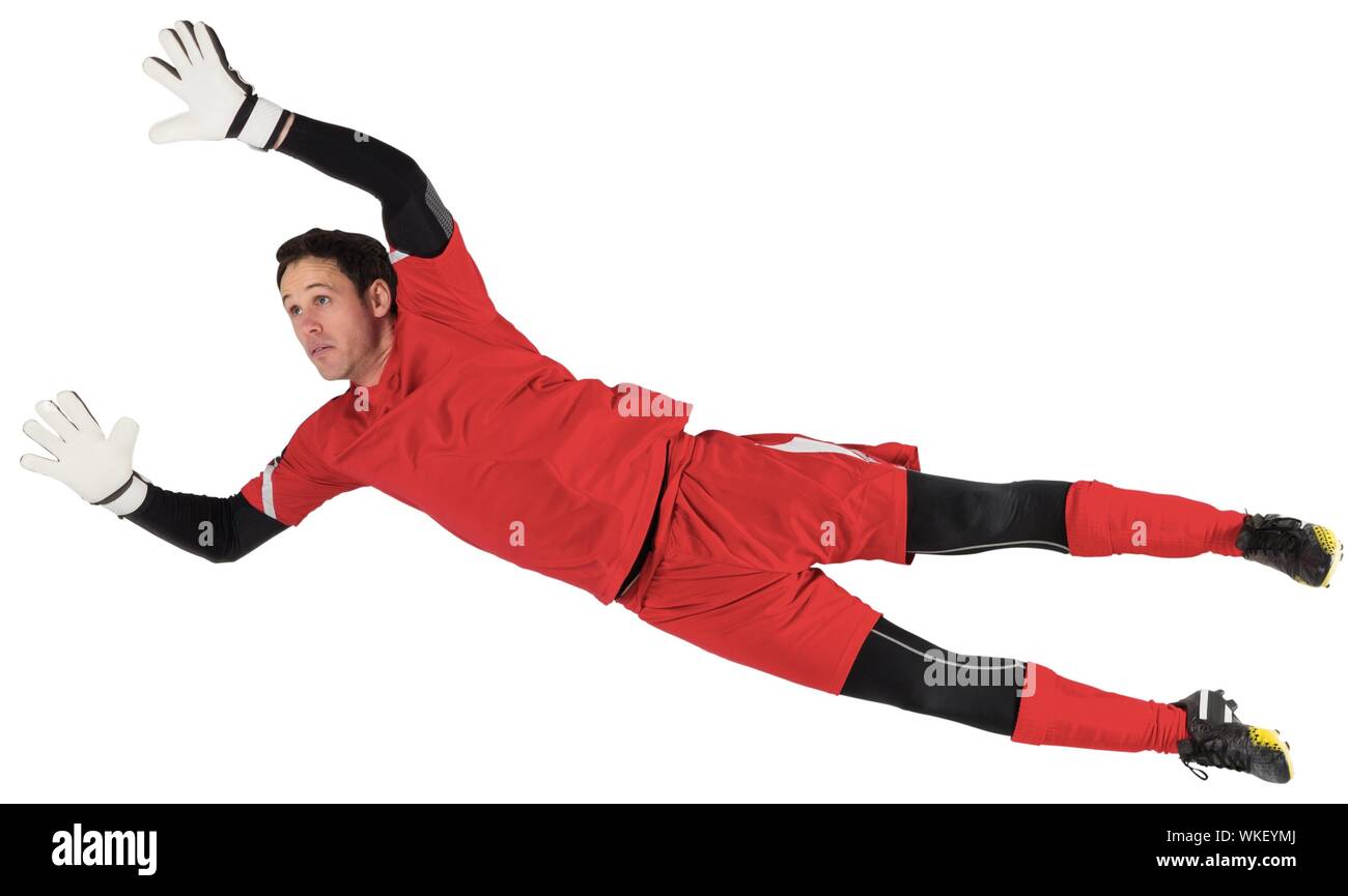 Fit goal keeper jumping up on white background Stock Photo - Alamy