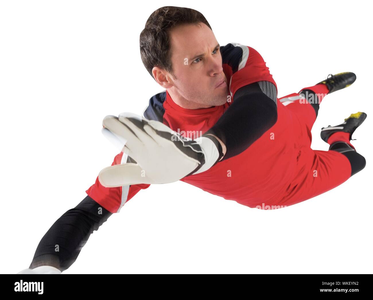 Fit goal keeper jumping up on white background Stock Photo - Alamy