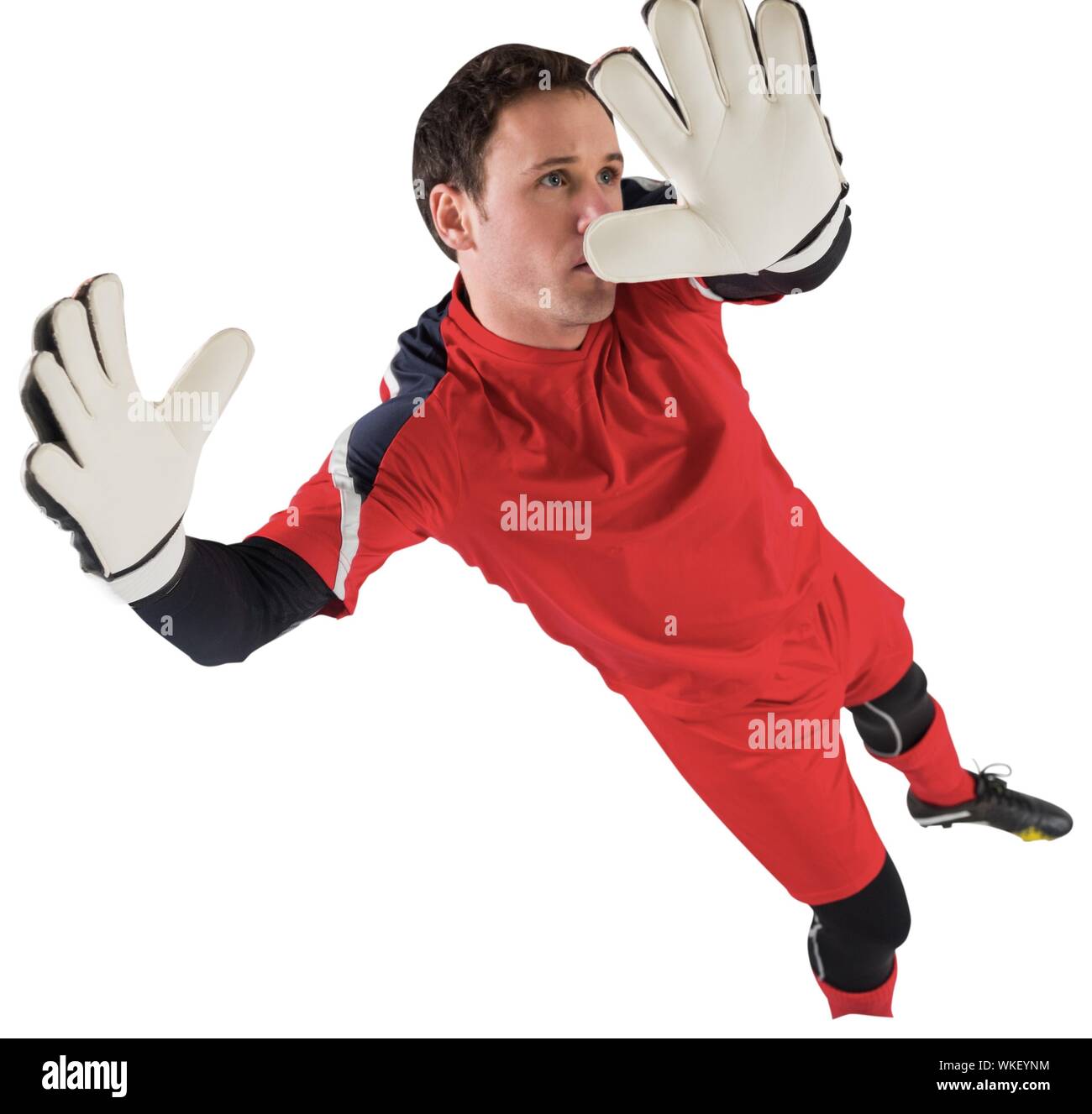 Fit goal keeper jumping up on white background Stock Photo - Alamy