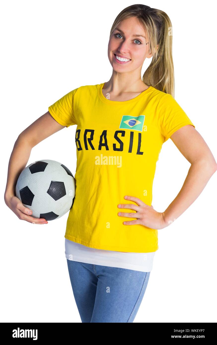 Pretty football fan in brasil t-shirt on white background Stock Photo ...