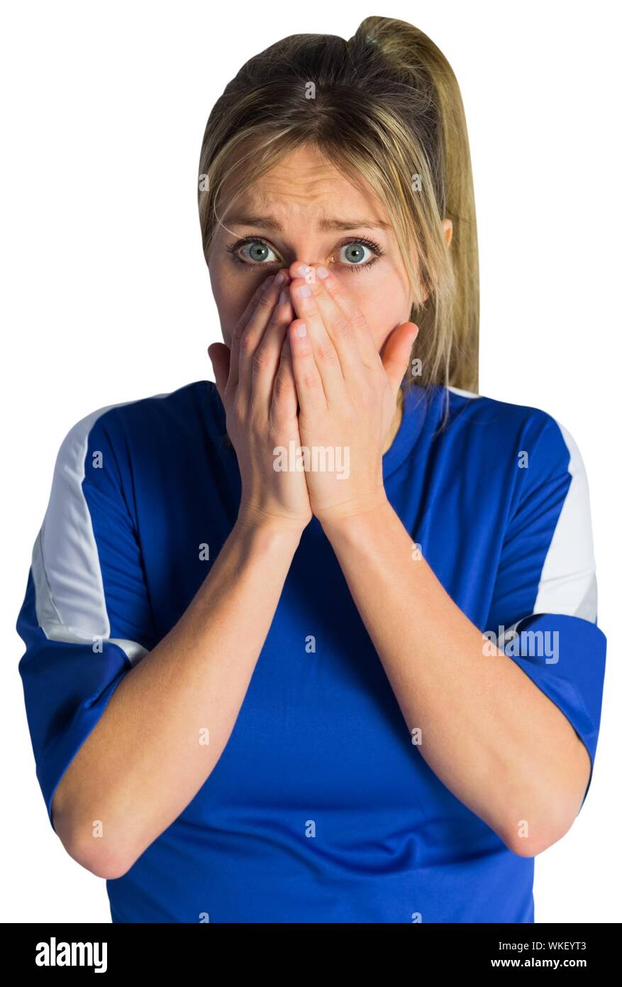 Nervous football fan in blue jersey on white background Stock Photo - Alamy