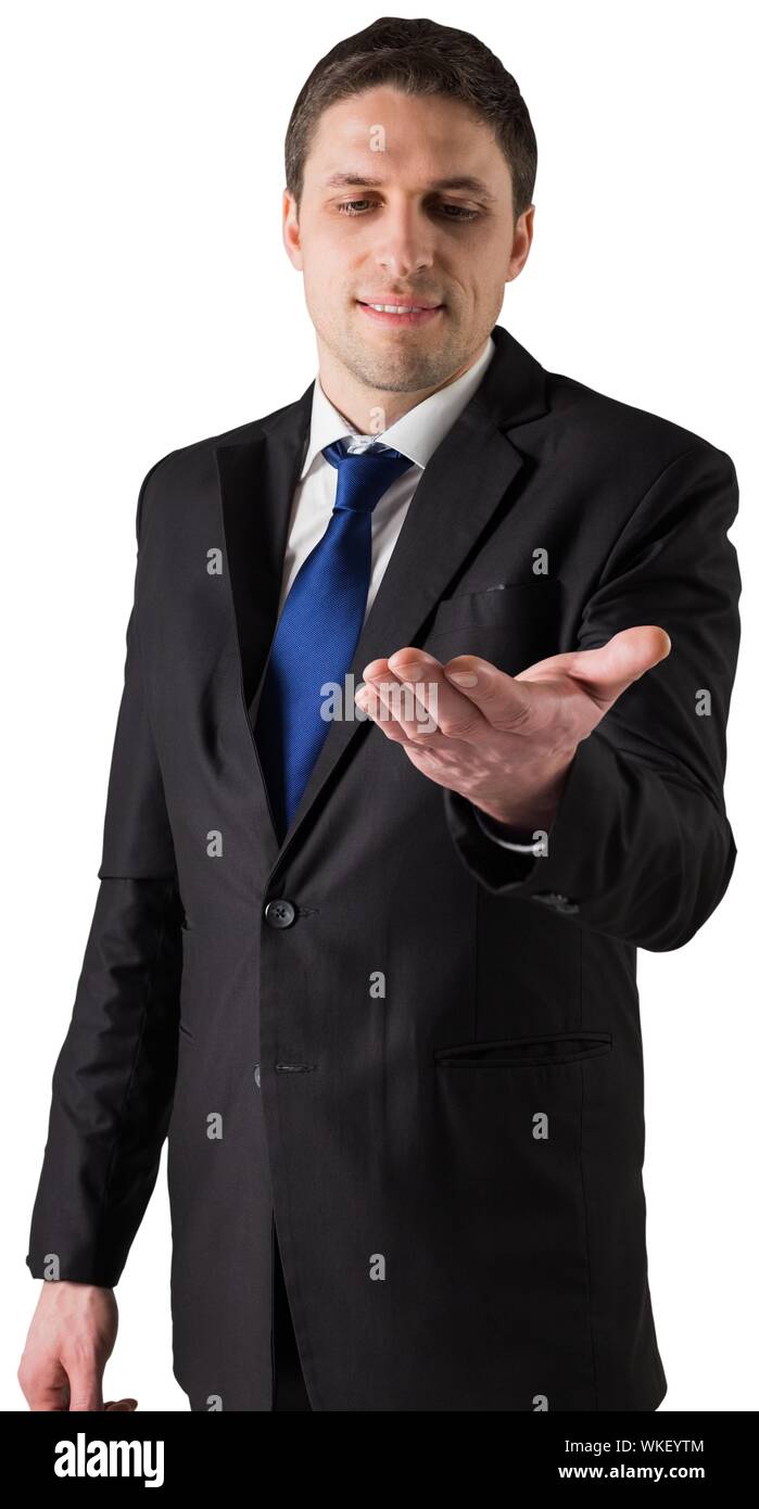 Handsome businessman holding hand out on white background Stock Photo ...