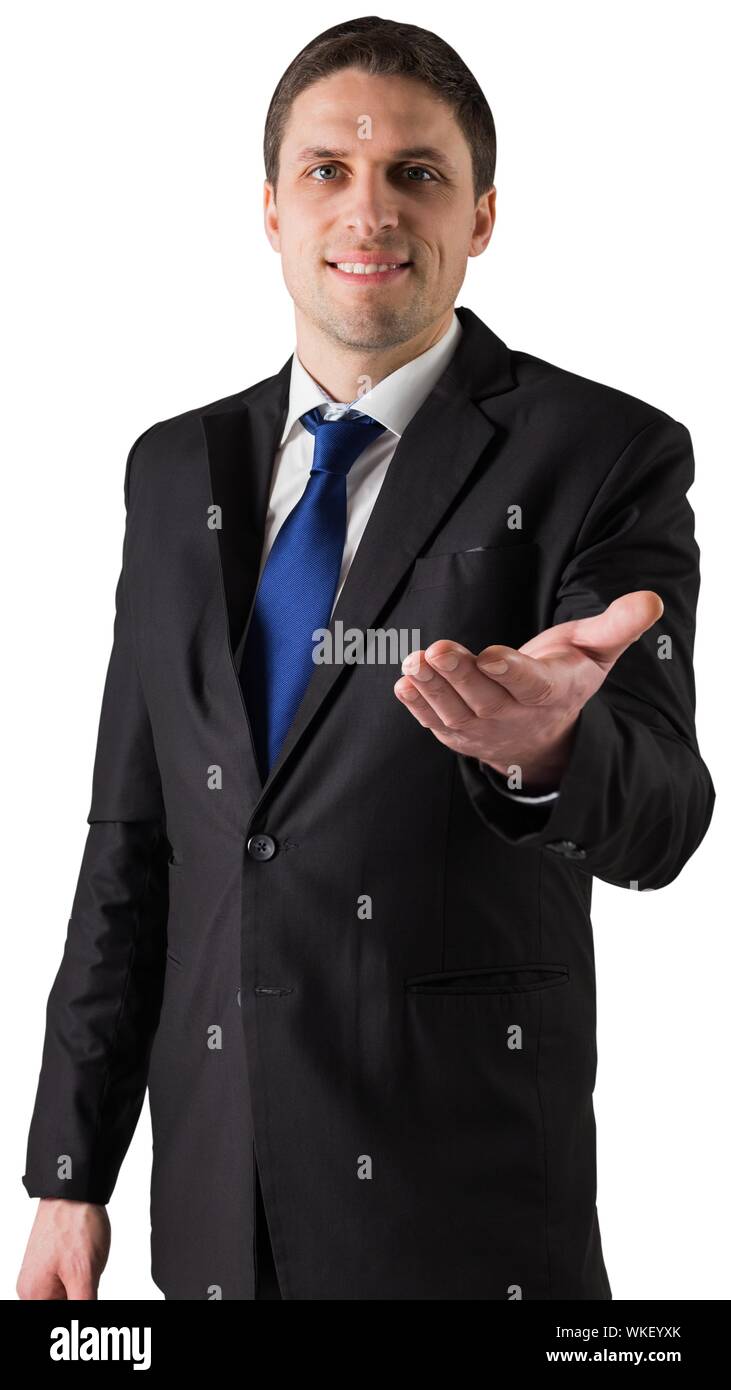Handsome businessman holding hand out on white background Stock Photo ...