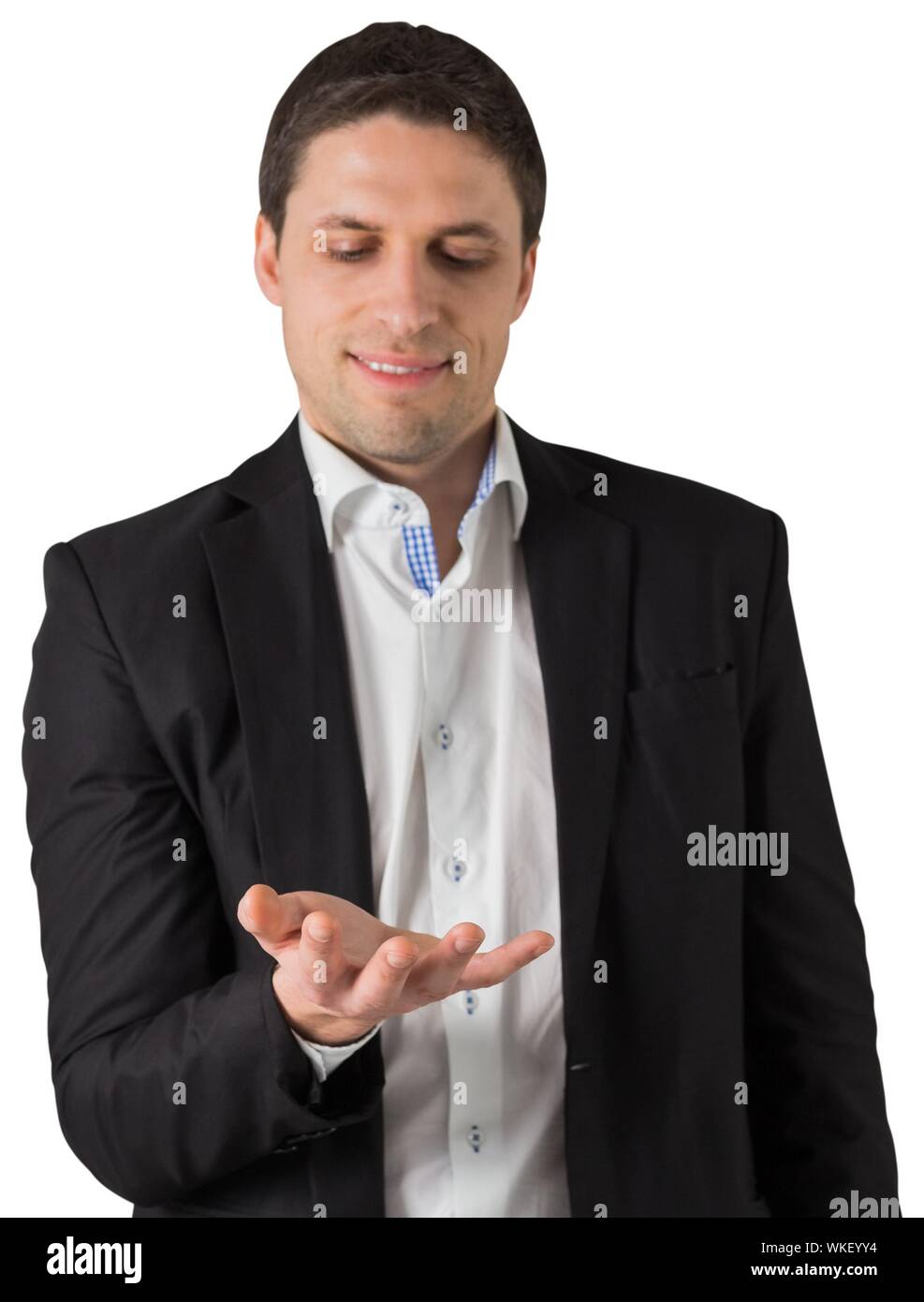 Handsome businessman holding hand out on white background Stock Photo ...
