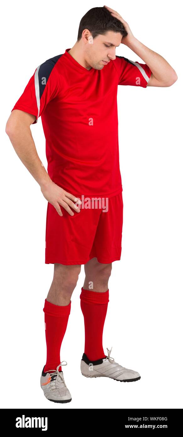 Disappointed football player looking down on white background Stock ...