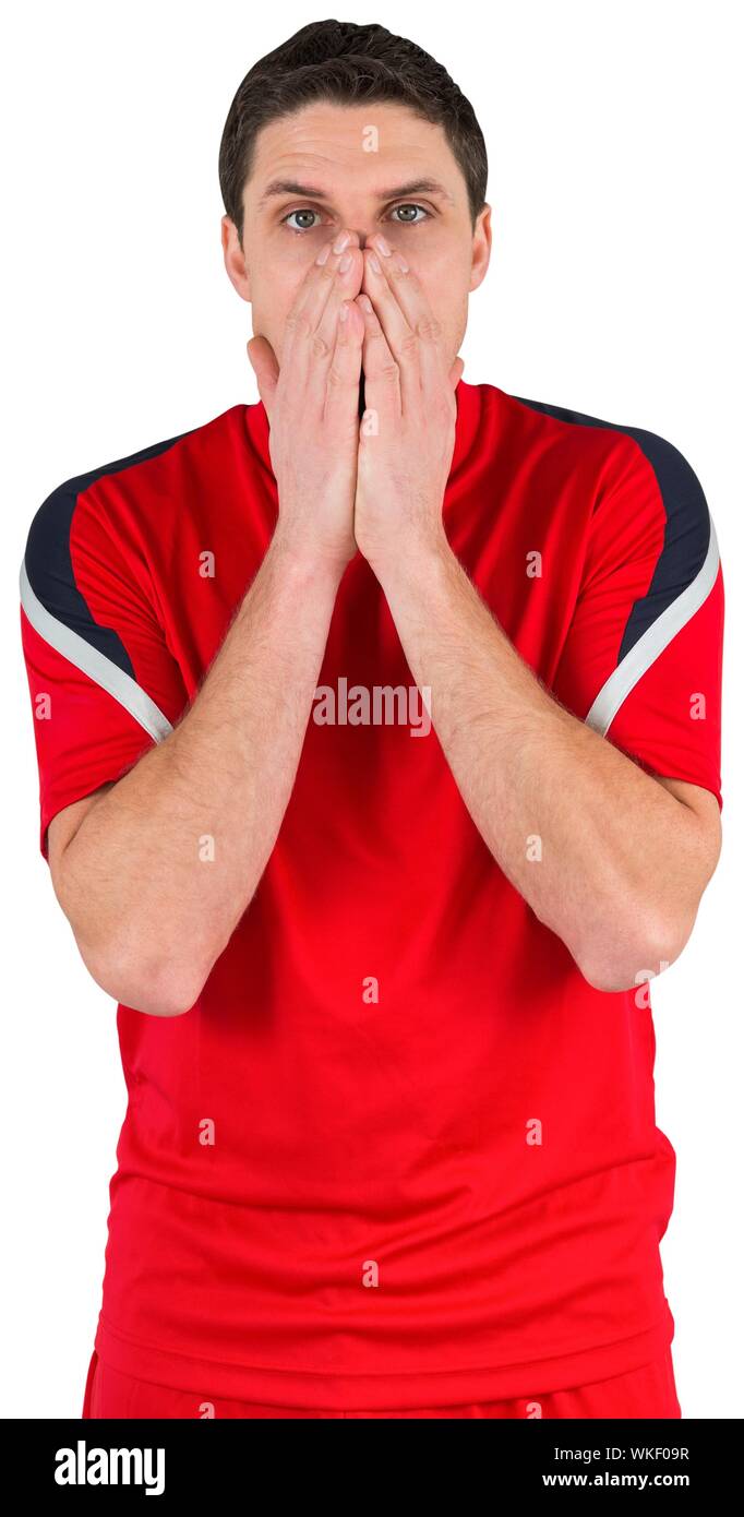 Nervous football player looking ahead on white background Stock Photo ...