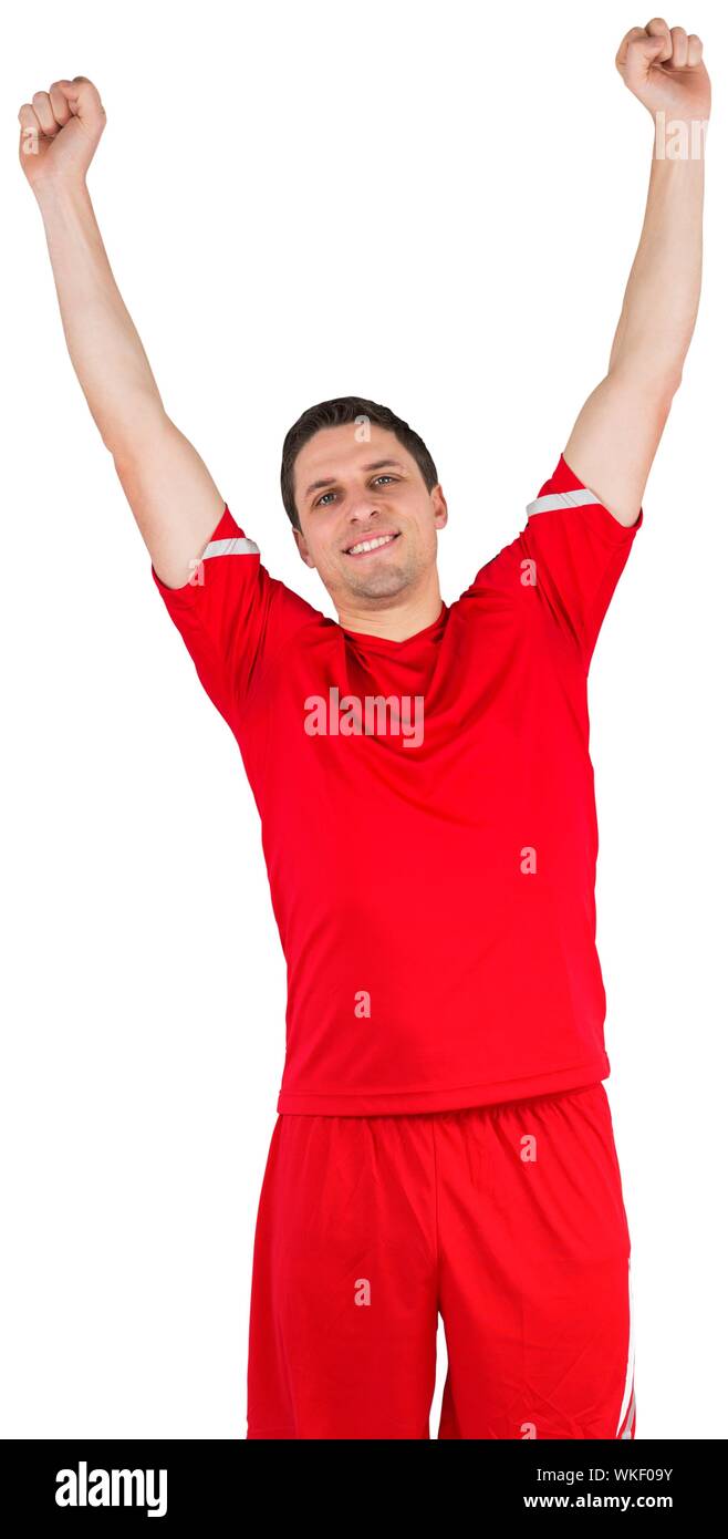 Excited young football player cheering on white background Stock Photo ...