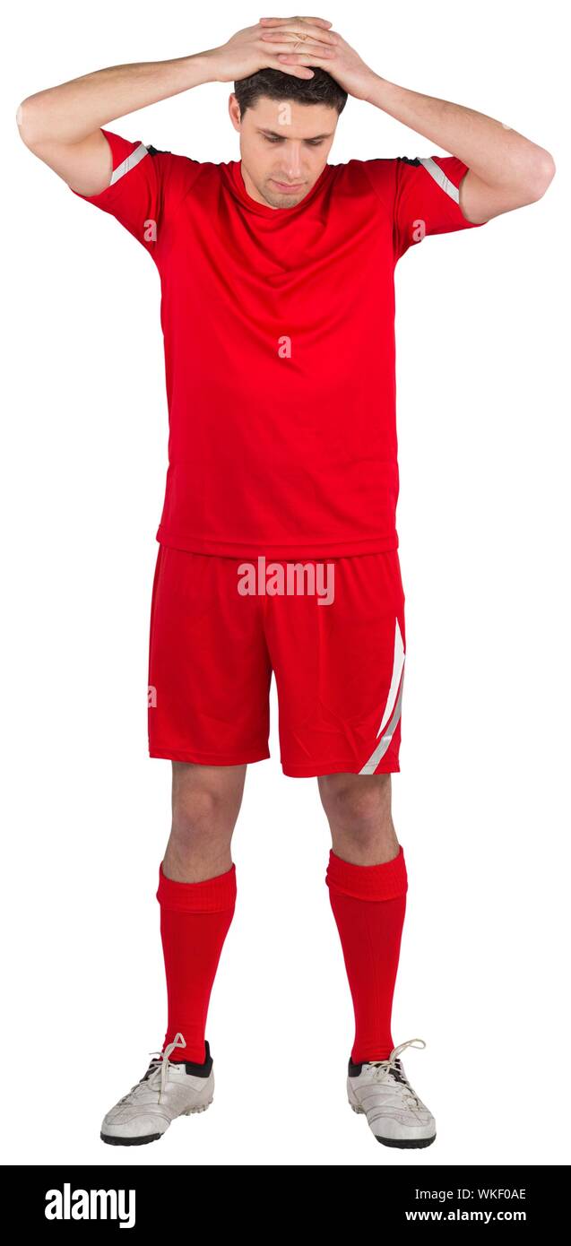 Disappointed football player looking down on white background Stock ...