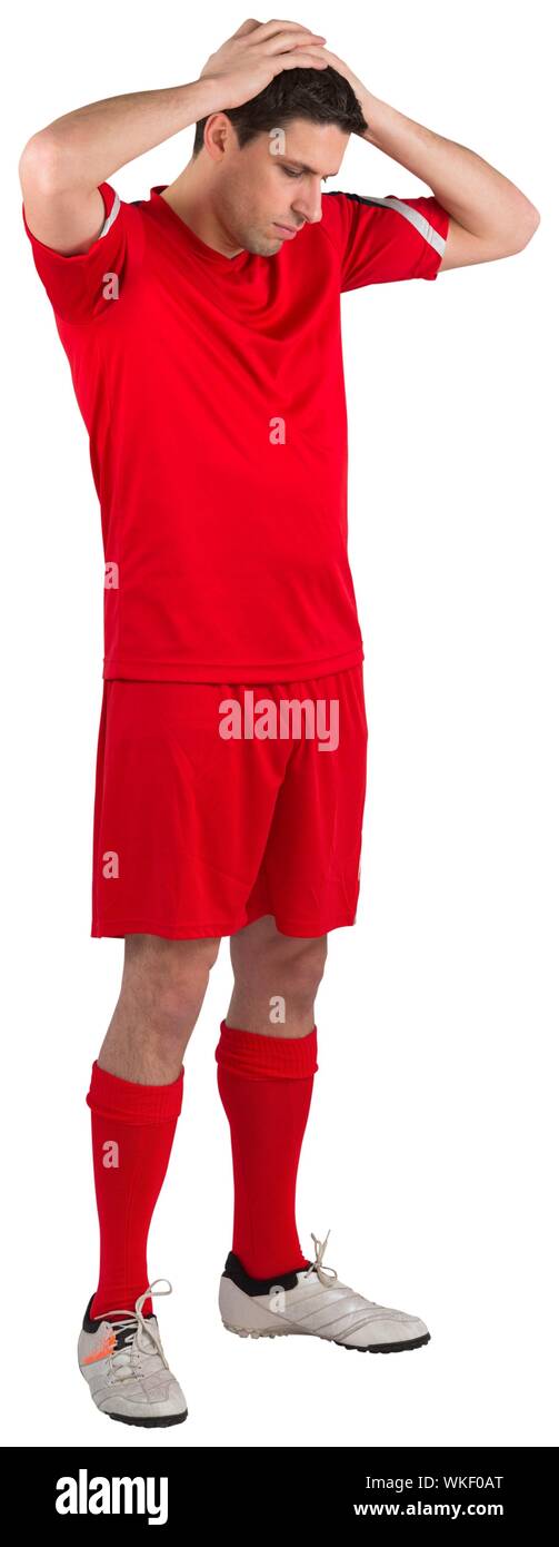 Disappointed football player looking down on white background Stock ...