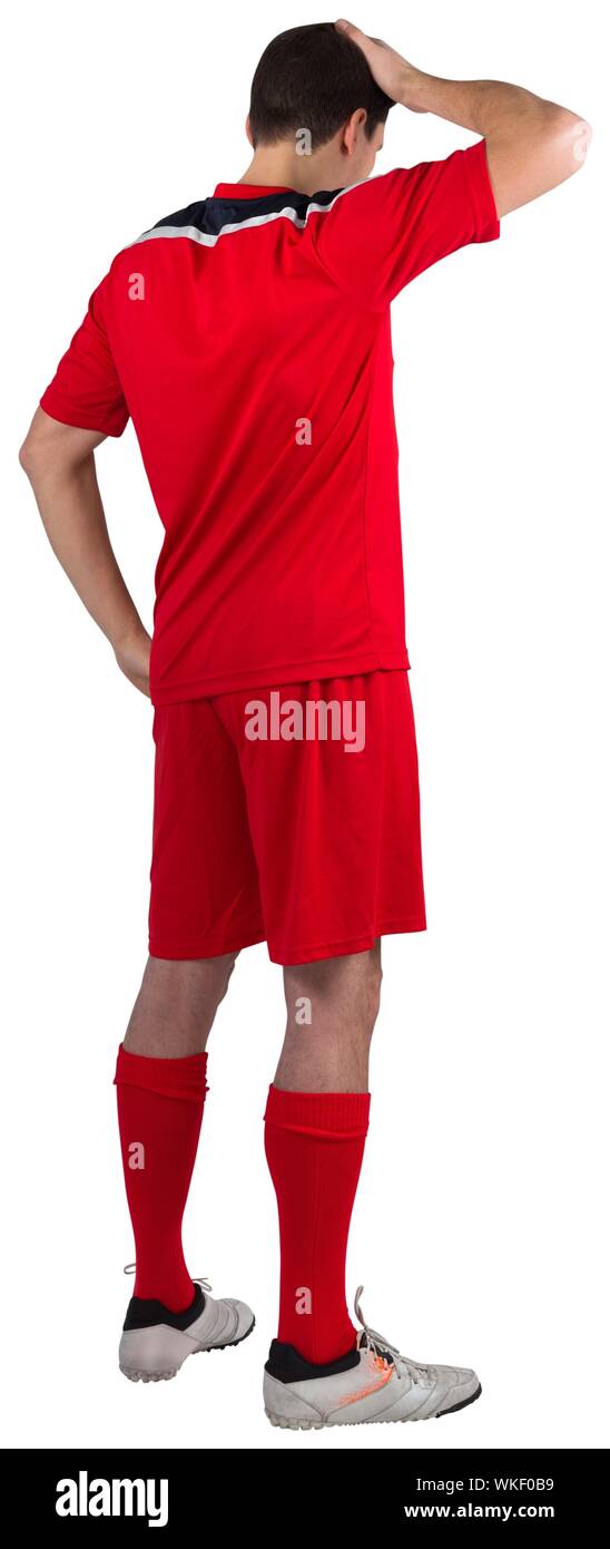 Disappointed football player looking down on white background Stock ...