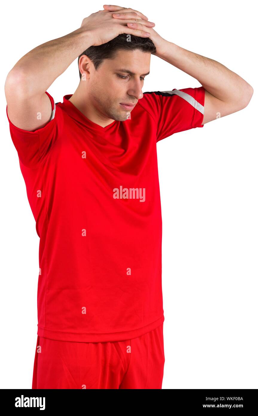 Disappointed football player looking down on white background Stock ...