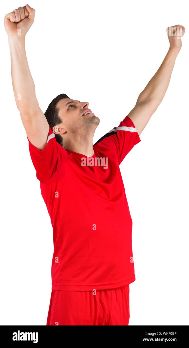 Excited young football player cheering on white background Stock Photo ...