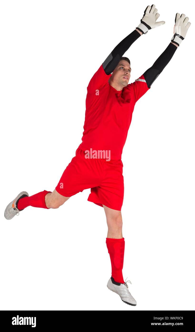 Fit goal keeper jumping up on white background Stock Photo - Alamy