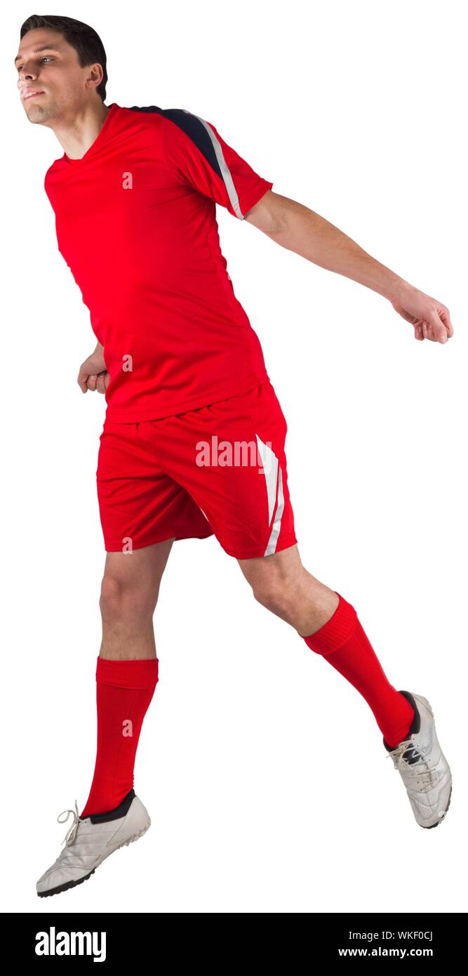 Fit football player jumping up on white background Stock Photo - Alamy