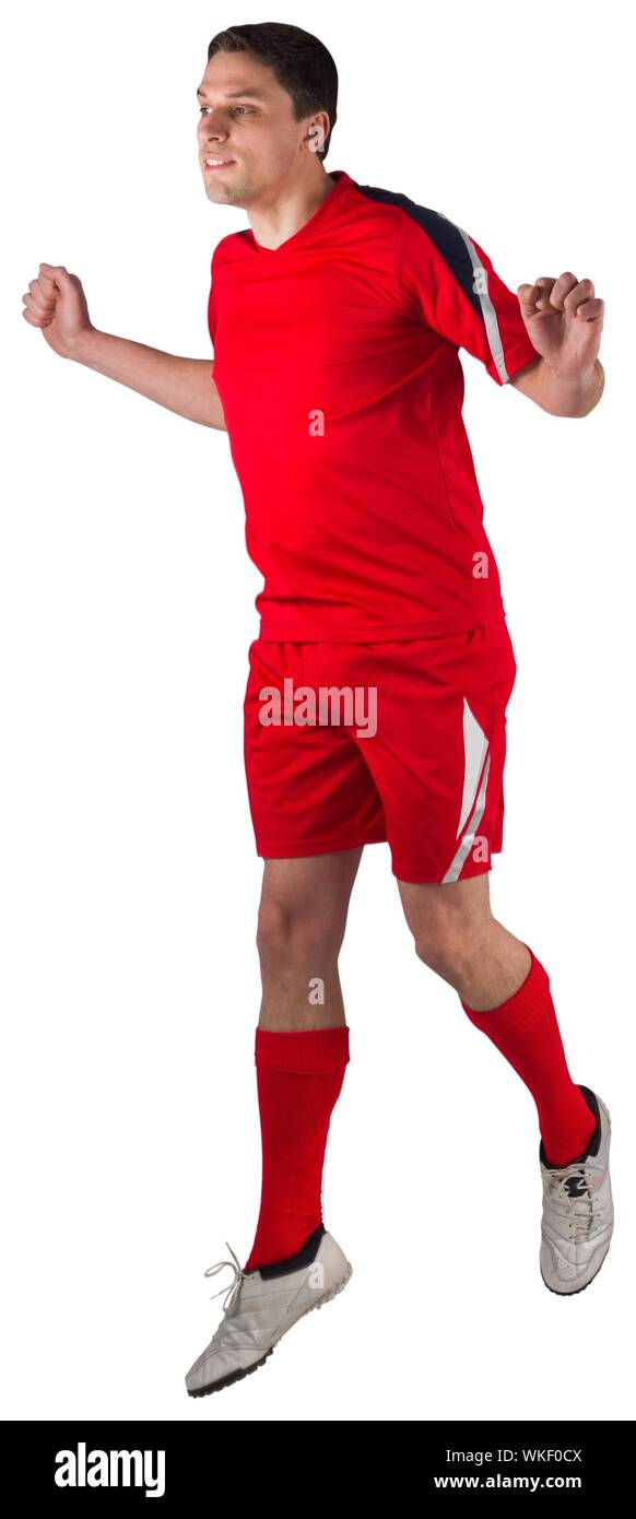 Fit football player jumping up on white background Stock Photo - Alamy