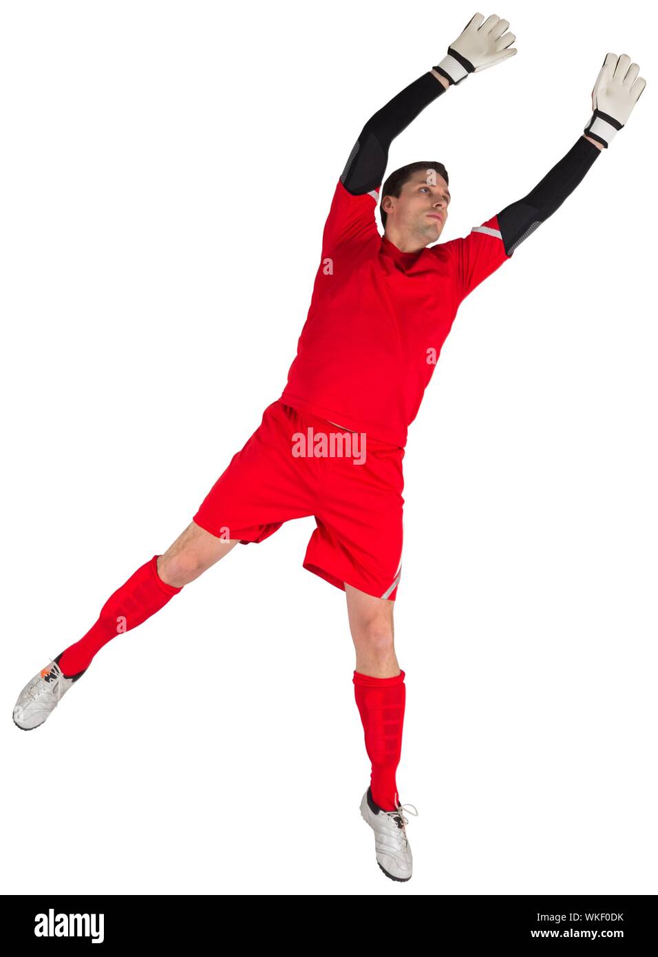 Fit goal keeper jumping up on white background Stock Photo - Alamy