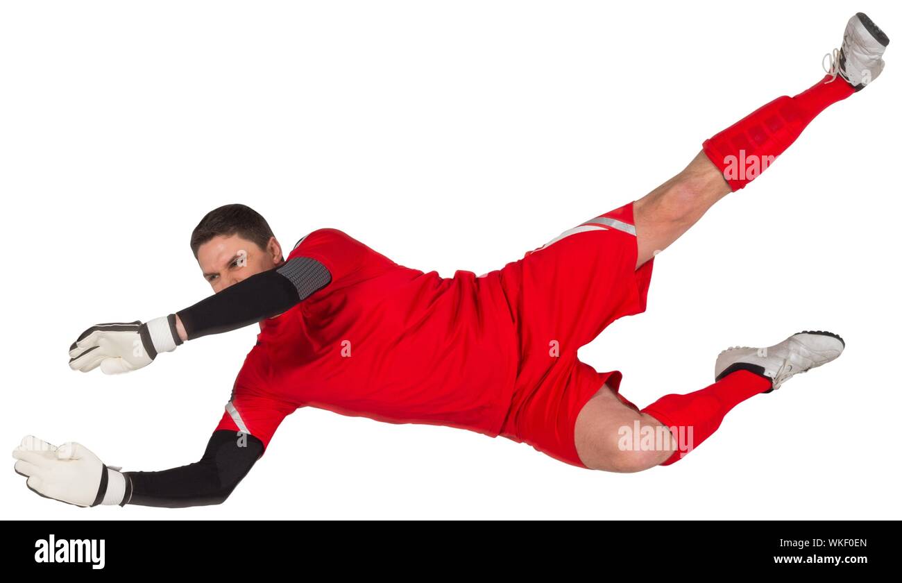 Fit goal keeper jumping up on white background Stock Photo - Alamy