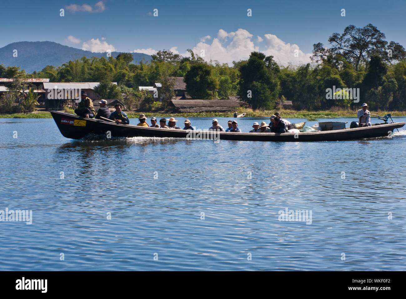Intha people in the traditional motorboat sailing on Inle Lake, Myanmar ...