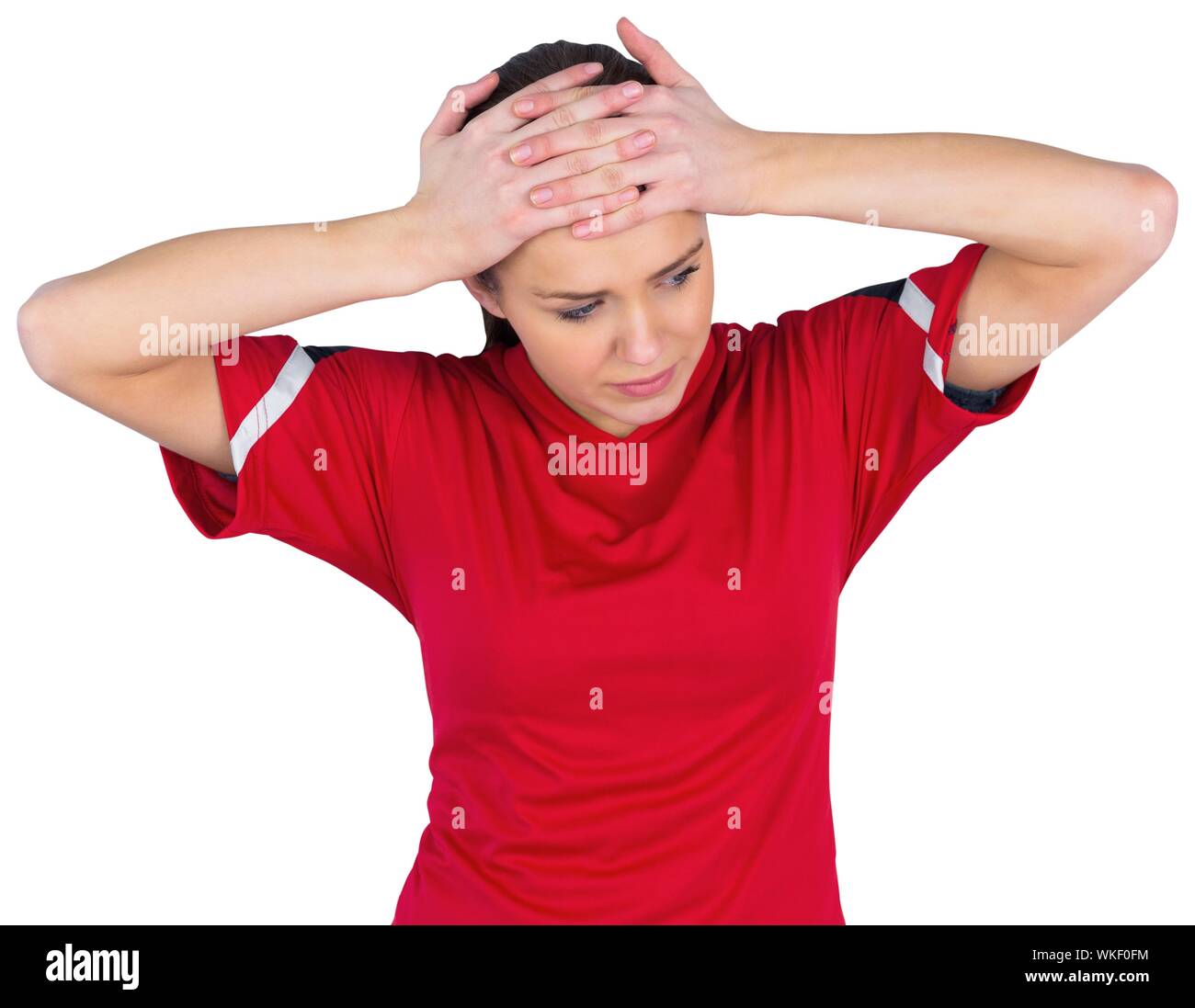 Disappointed football fan in red on white background Stock Photo - Alamy