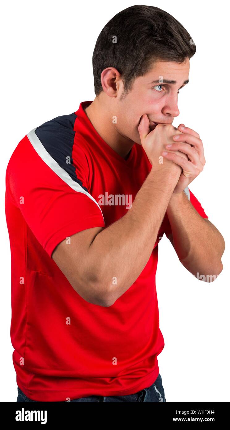 Nervous football fan in red on white Stock Photo - Alamy