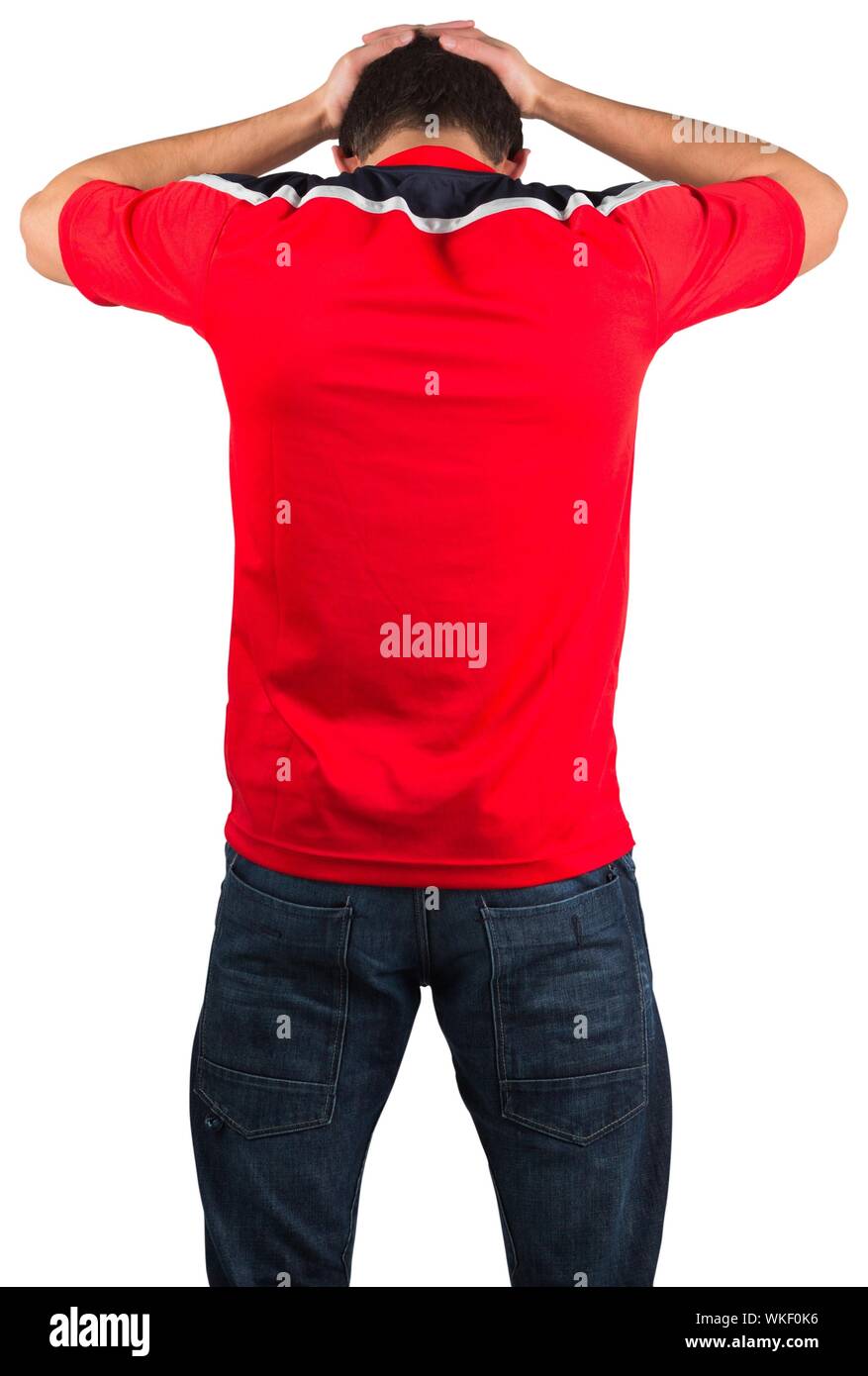 Disappointed football fan in red on white background Stock Photo - Alamy