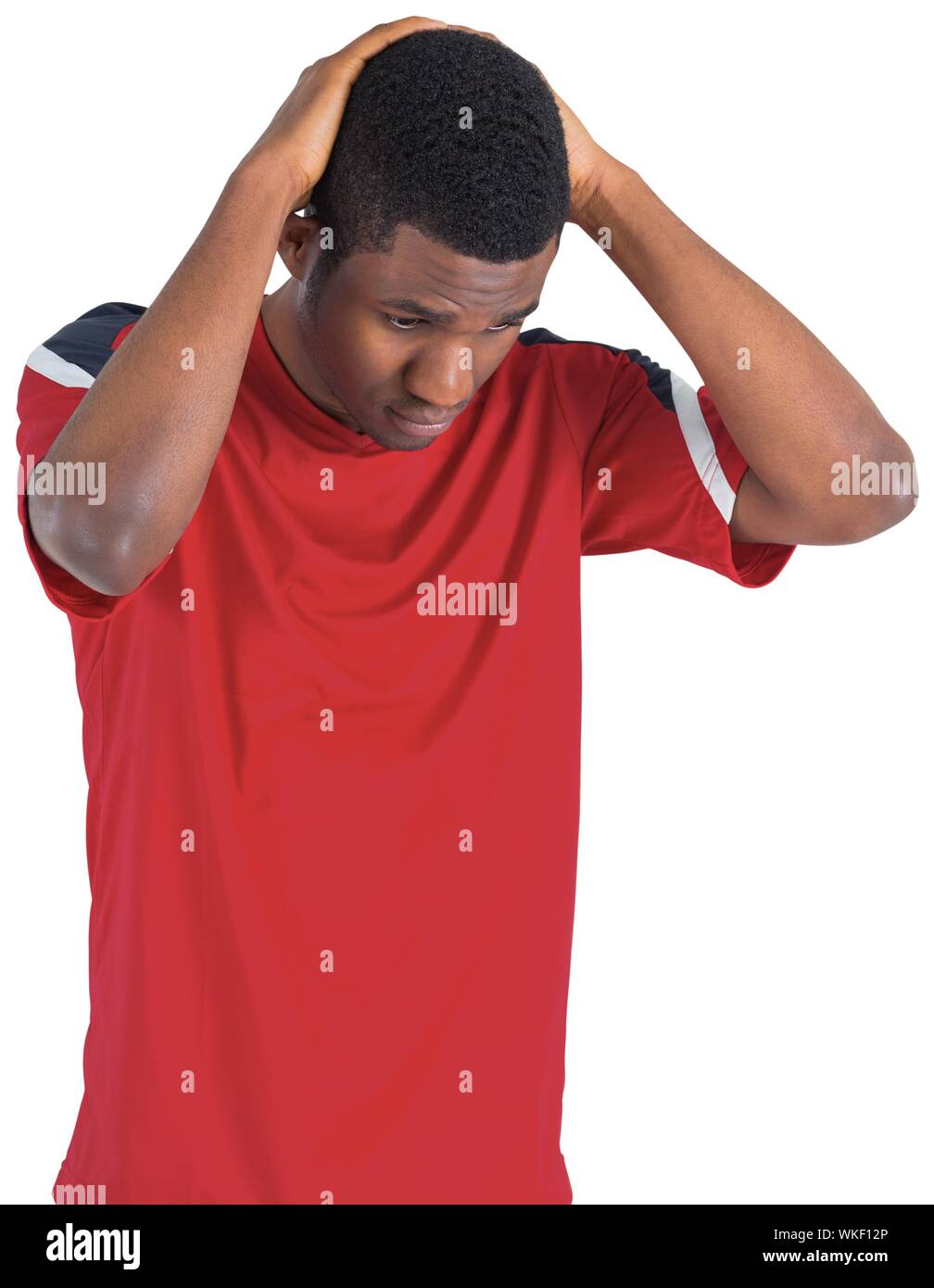 Disappointed football fan looking down on white background Stock Photo ...