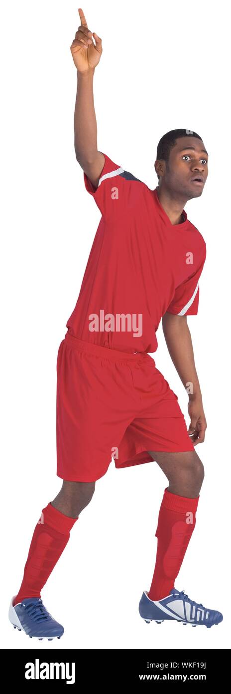 Football player in red raising his hand on white background Stock Photo ...