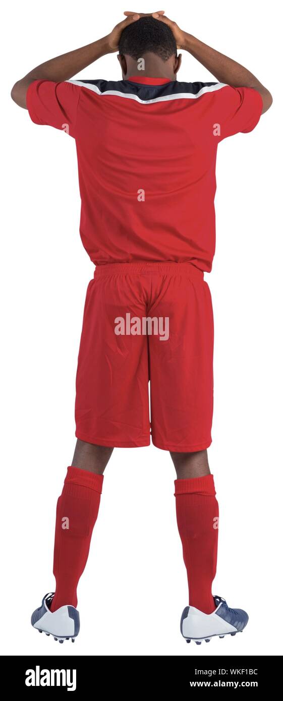 Disappointed football player looking down on white background Stock ...