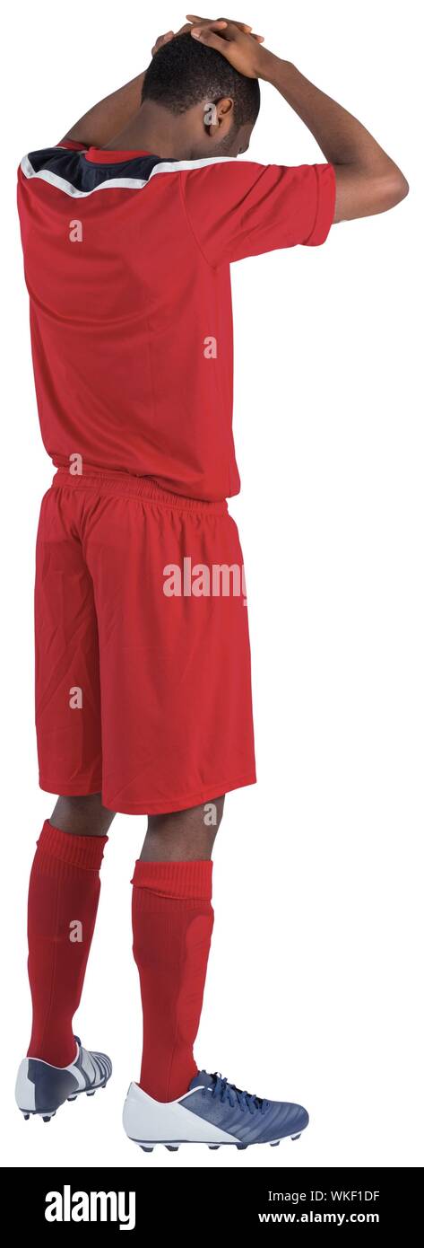Disappointed football player looking down on white background Stock ...