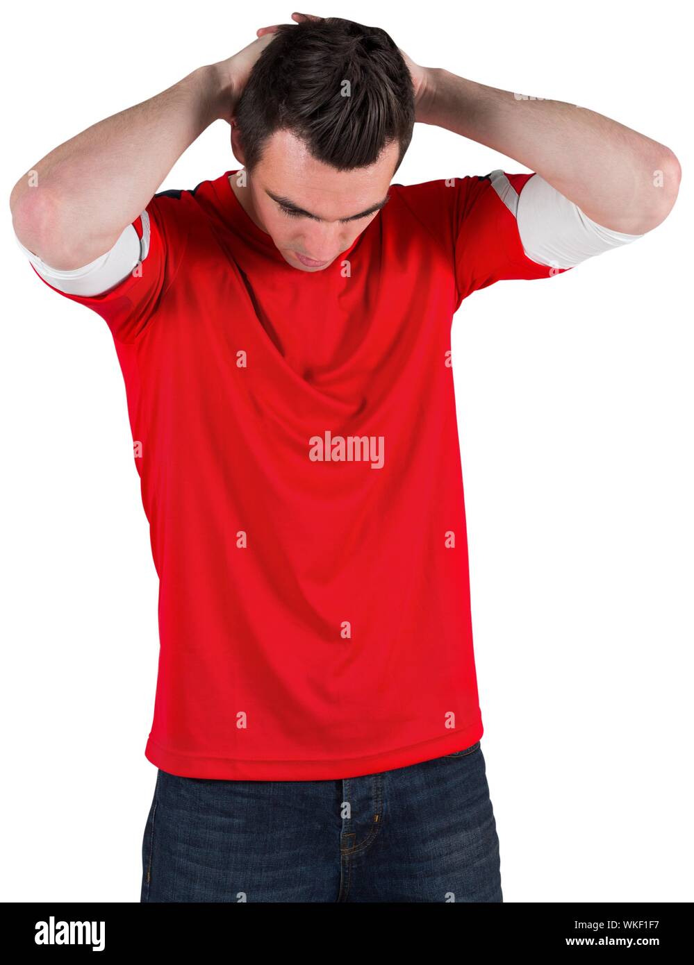 Disappointed football fan looking down on white background Stock Photo ...