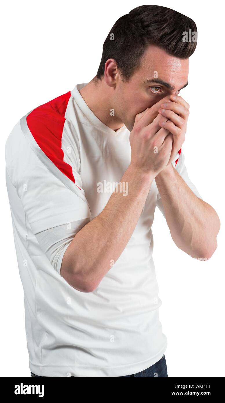 Disappointed football fan looking down on white background Stock Photo ...