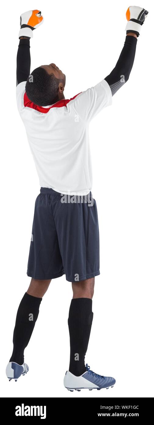 Excited goalkeeper in white cheering on white background Stock Photo ...