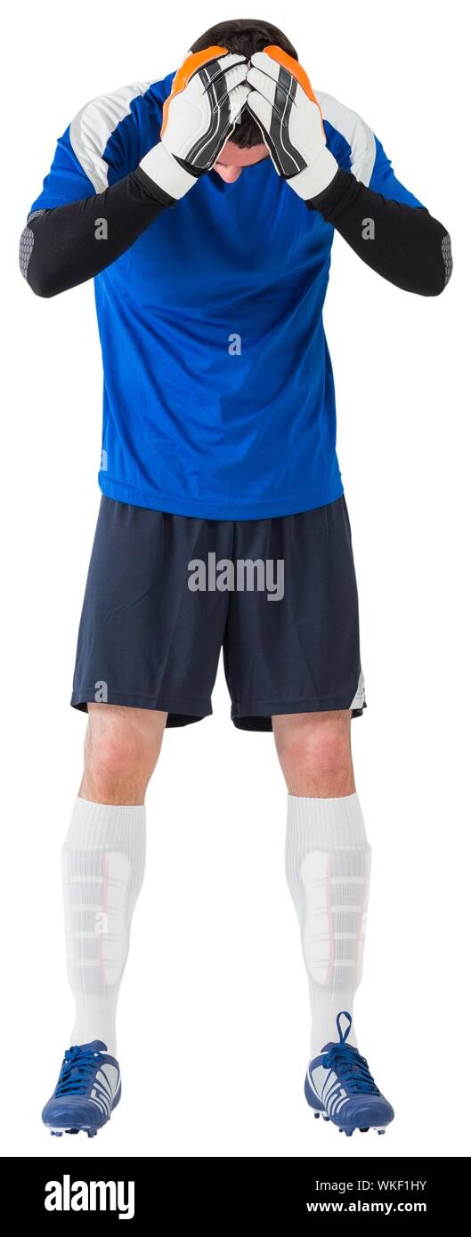 Disappointed football player looking down on white background Stock ...