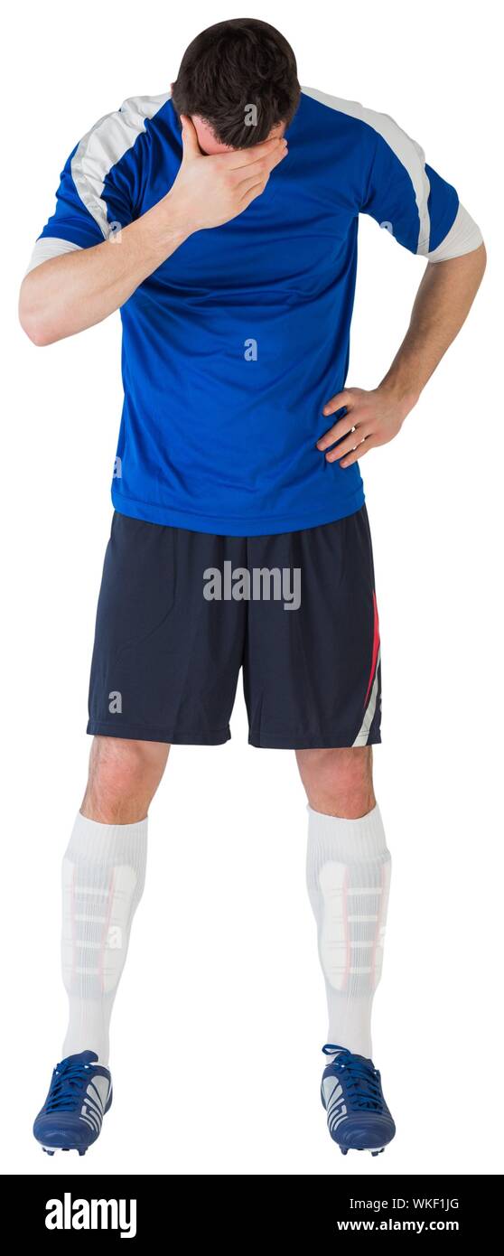 Disappointed football player looking down on white background Stock ...