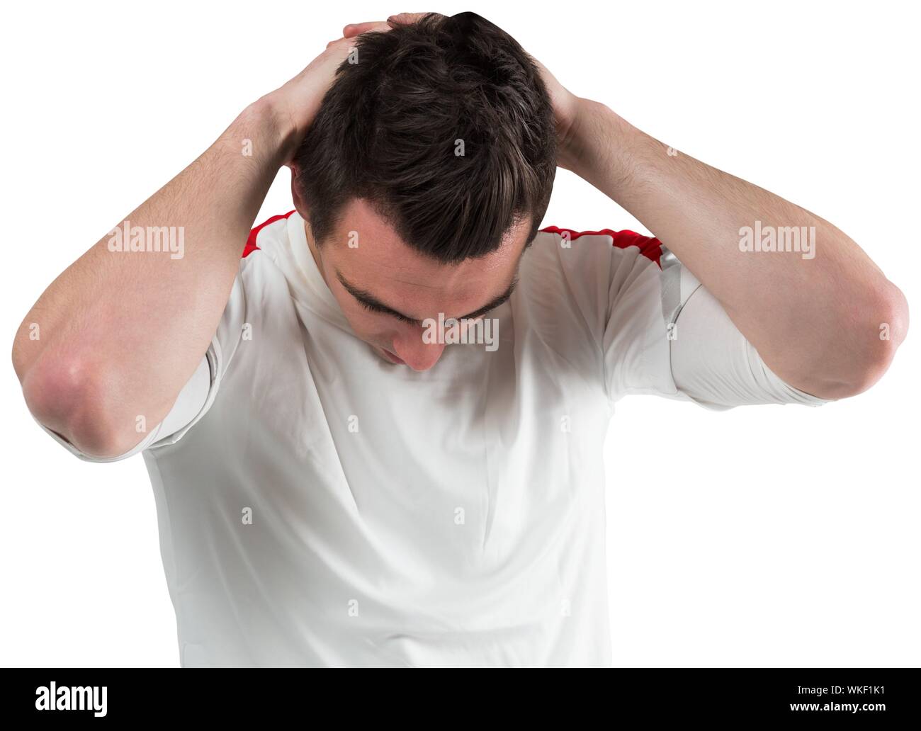 Disappointed football fan looking down on white background Stock Photo ...